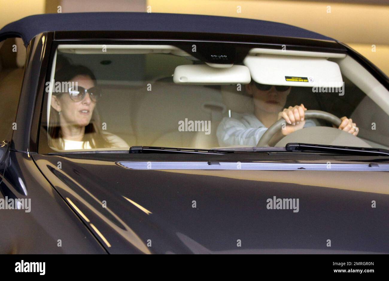 Actress Katie Holmes looks very focused while driving as she leaves the ...