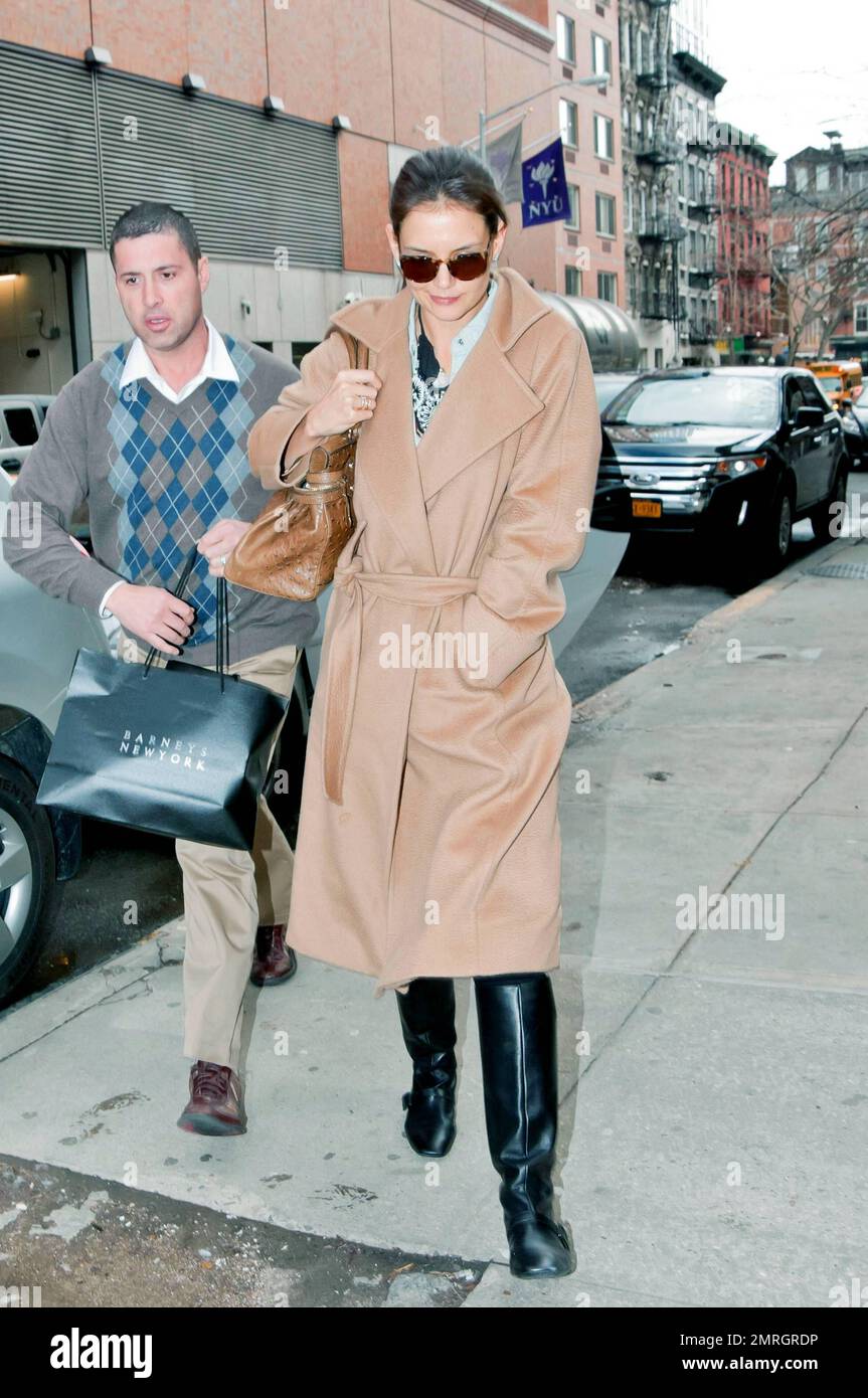 Actress Katie Holmes flashes her famous smirk as she does some shopping ...