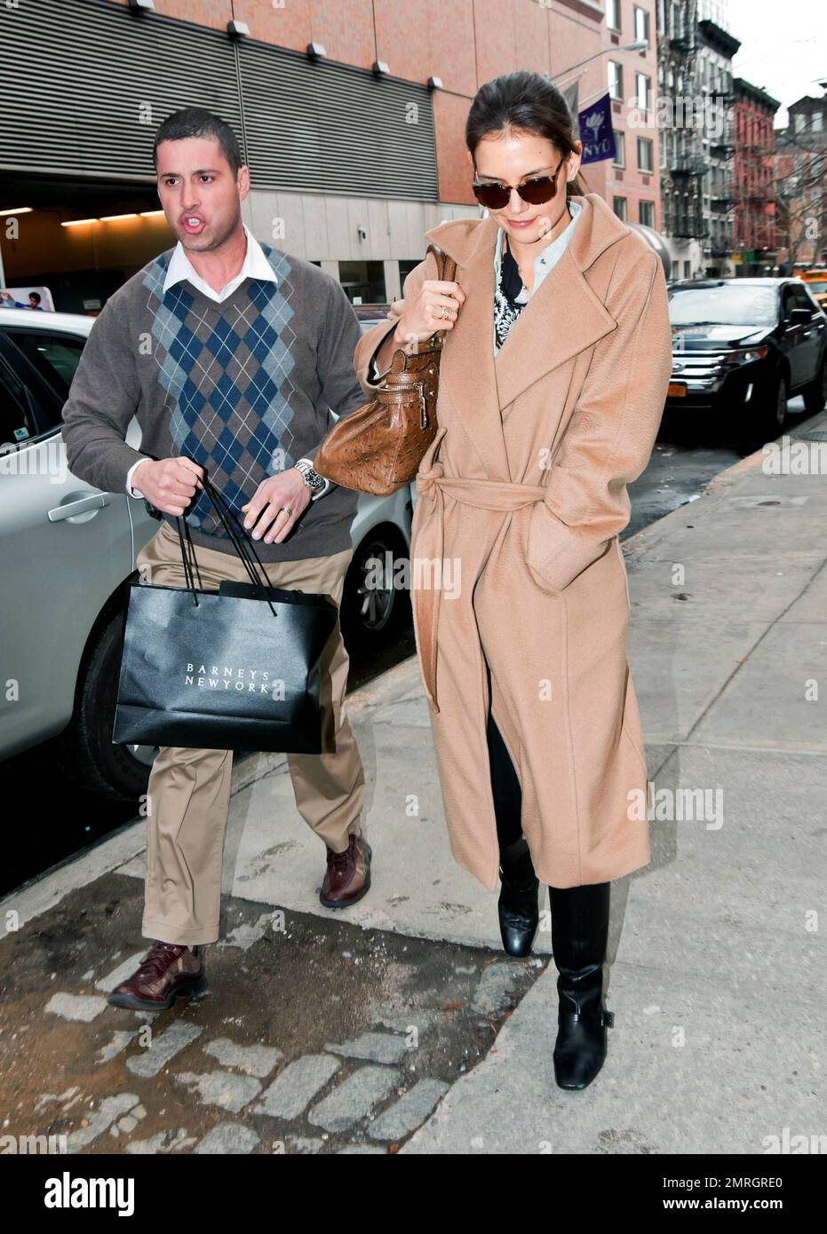 Actress Katie Holmes flashes her famous smirk as she does some shopping ...