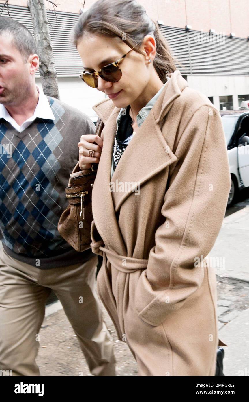 Actress Katie Holmes flashes her famous smirk as she does some shopping ...