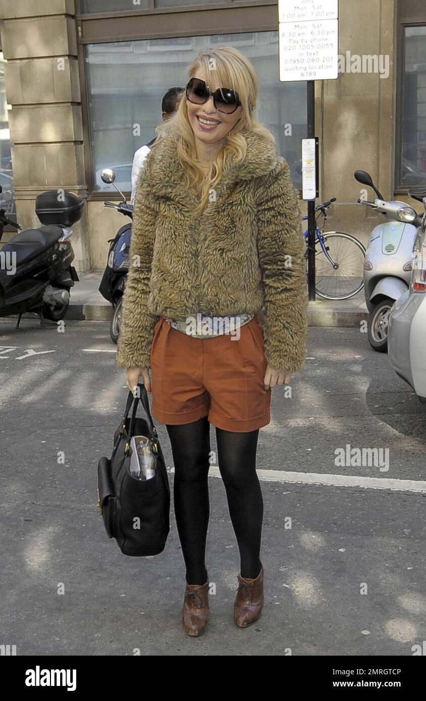 Former model and television presenter Katie Piper is all smiles outside ...