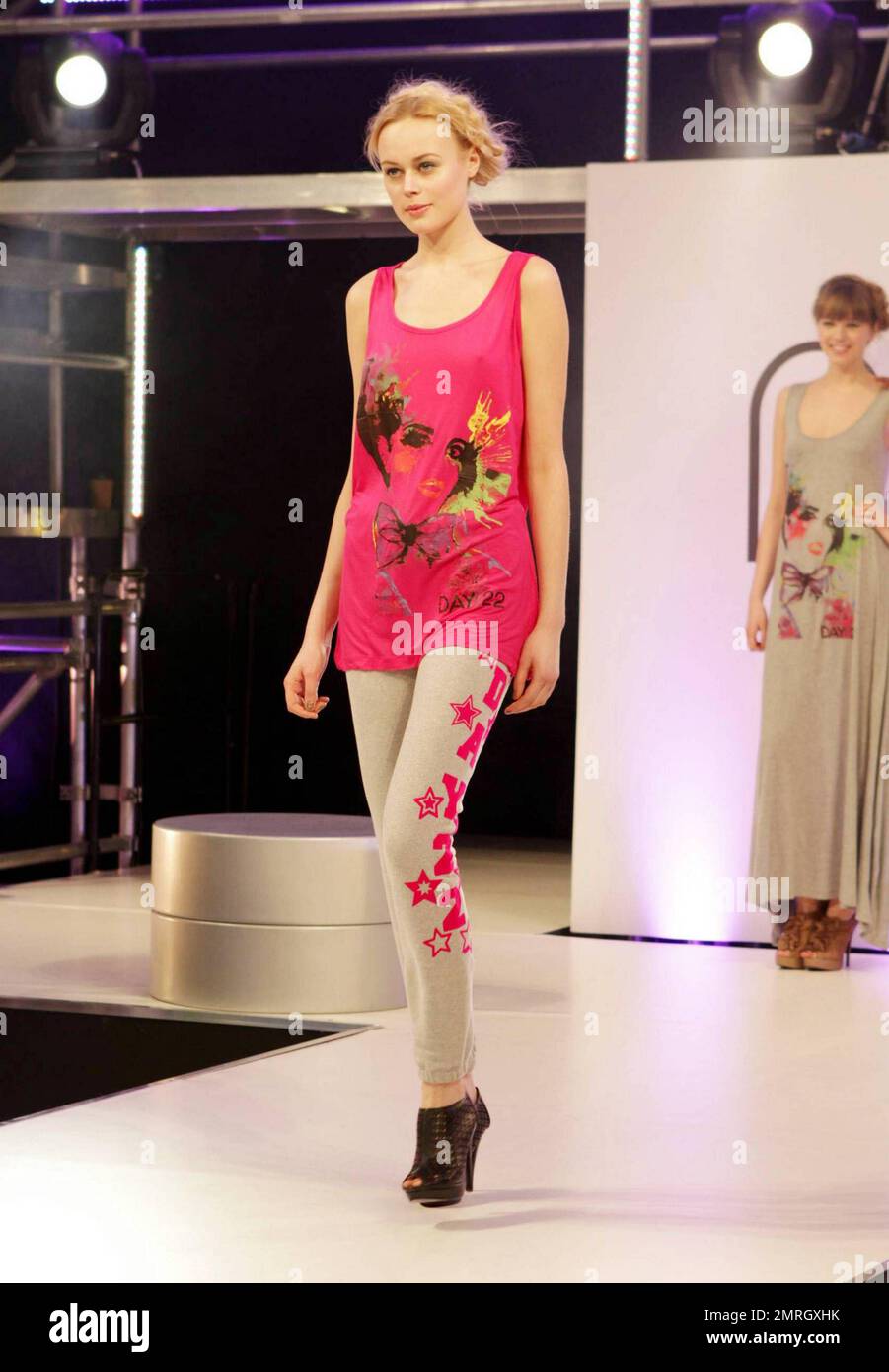 Wearing a black and white patterned tracksuit with skull patterned high ...