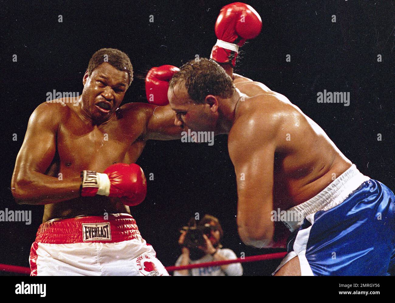 FILE – In this March 15, 1985, file photo, Larry Holmes, left, battles ...