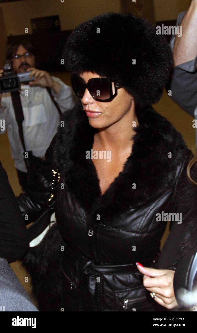 Katie Price (aka Jordan) is all smiles and dressed warmly in a black ...