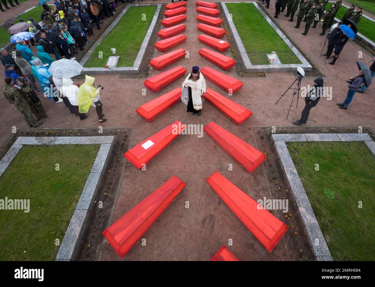 An Orthodox priest conducts a burial ceremony of Soviet soldiers killed ...
