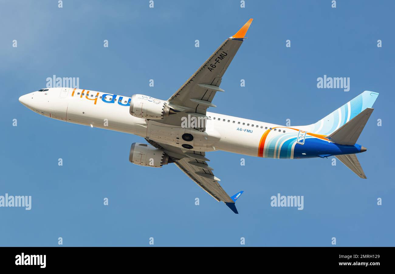 A closeup of the Boeing 737 of Flydubai on a clear blue sky background ...