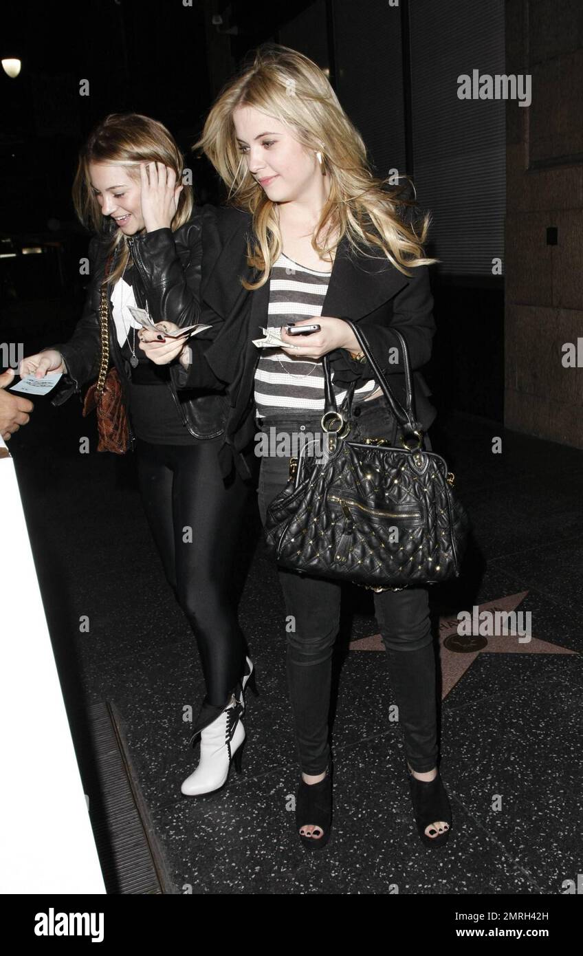 Actress Ashley Benson and a friend smile for the camera as they leave ...