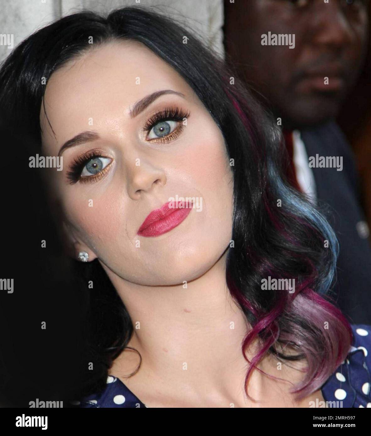 Katy Perry smiles as she greets fans and signs autographs for her many ...