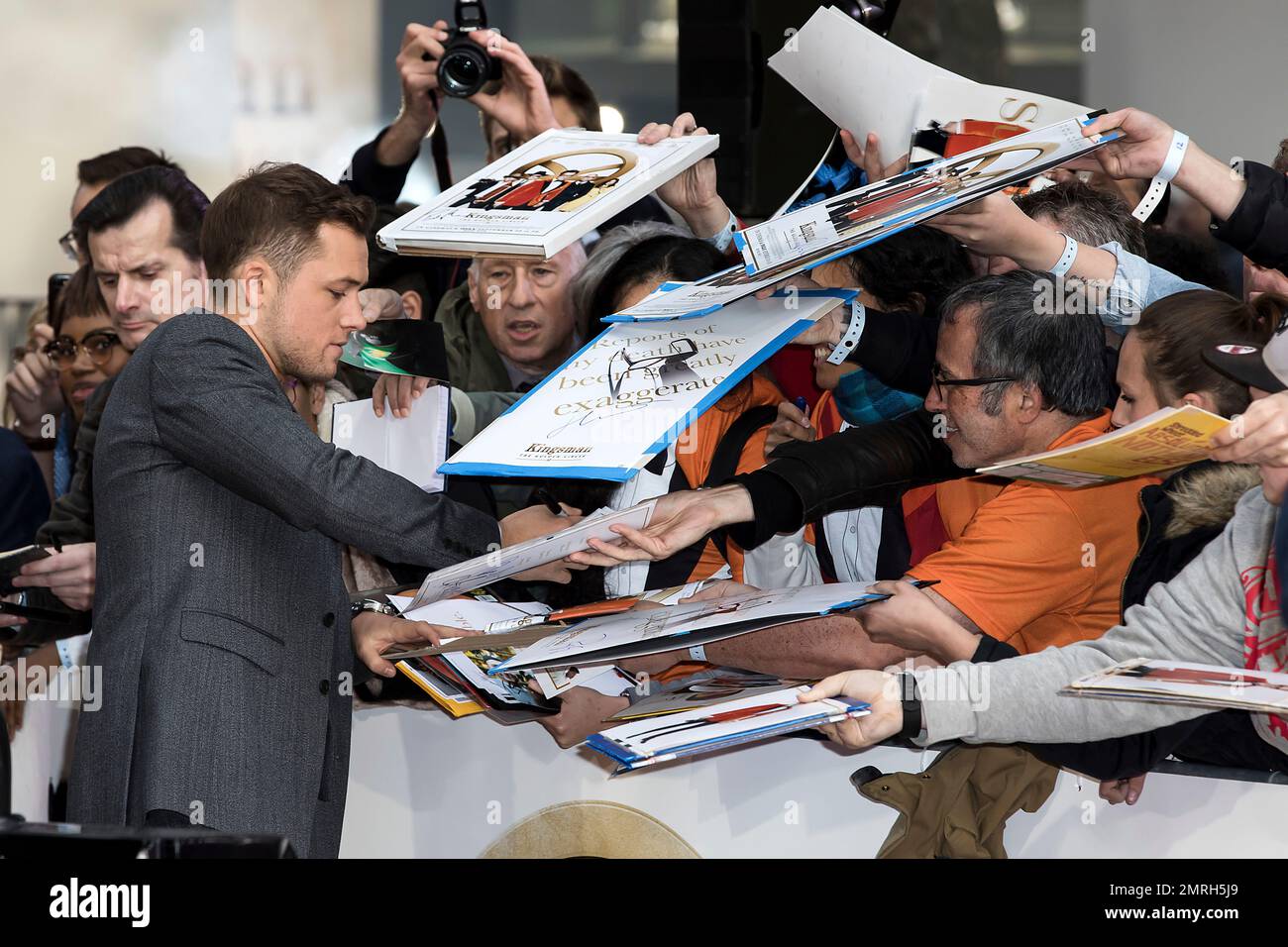 Actor Taron Egerton signs autographs on arrival at the premiere of the ...