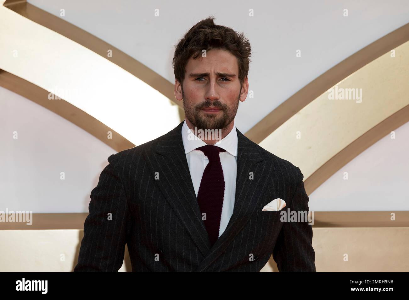 Actor Edward Holcroft poses for photographers on arrival at the ...