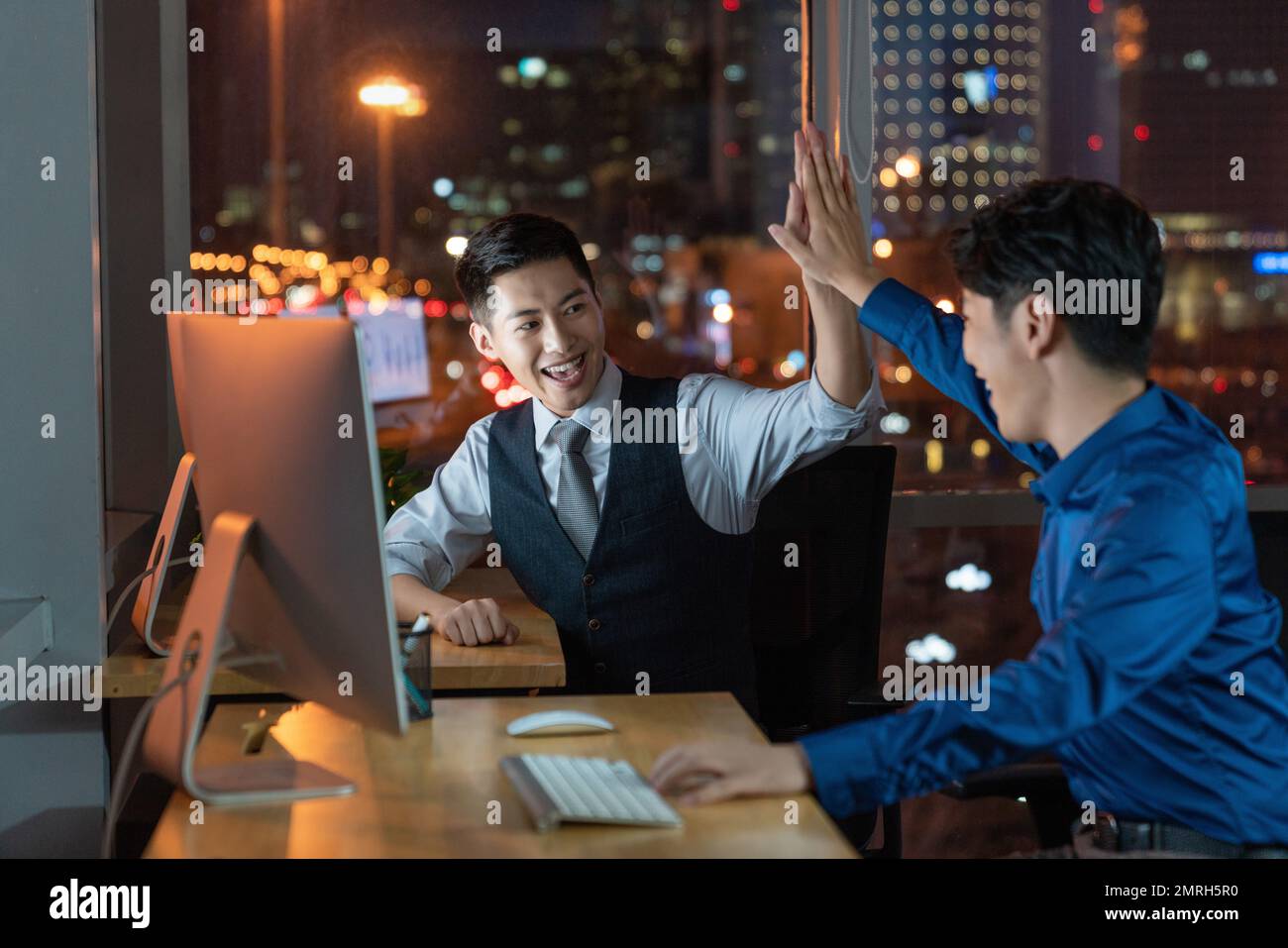 Young business people in work overtime Stock Photo - Alamy
