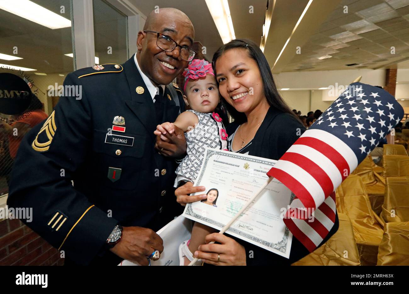 Liezel Damian Thomas, of the Philippines, right, proudly shows off her ...