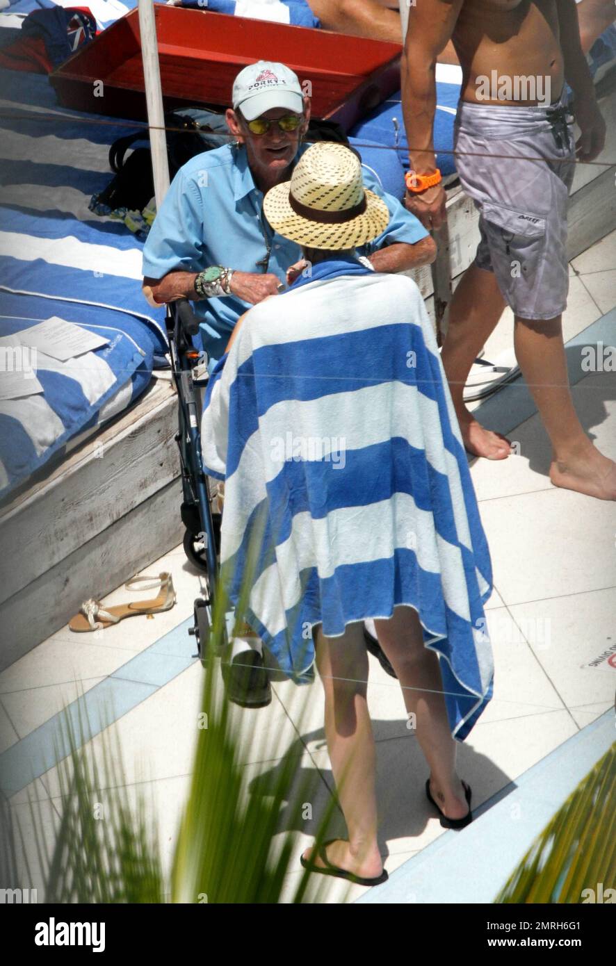 Katy Perry shows off her figure in a black string bikini during a break ...