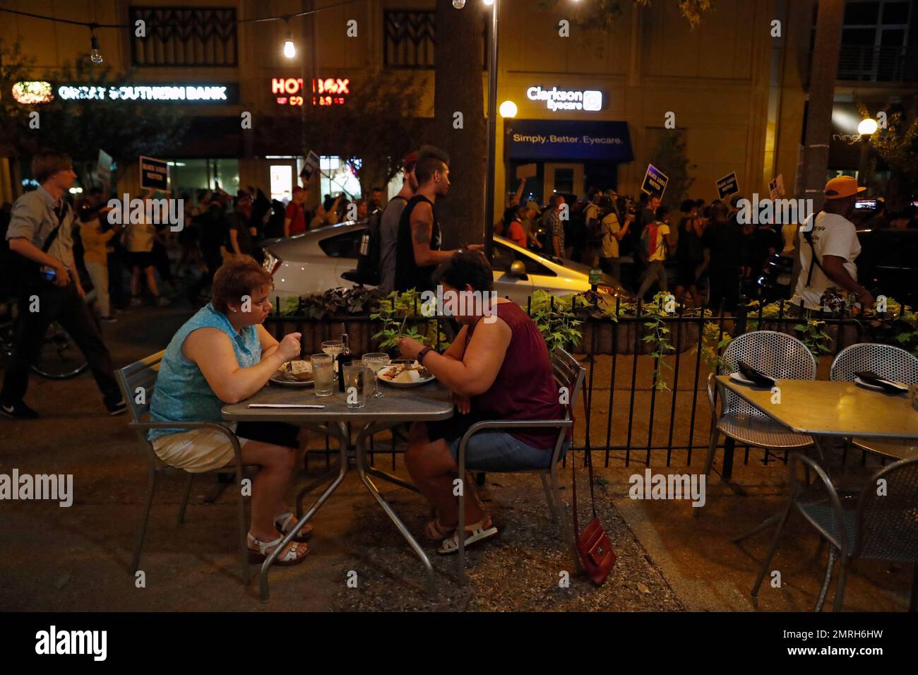 FILE - In this Sept. 15, 2017 file photo, restaurant patrons eat their ...