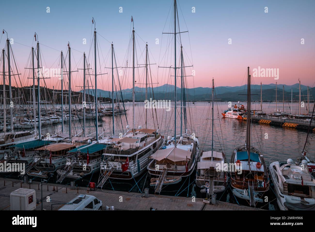 A scenic view of a beautiful sunset in the port of Fethiye with old ...