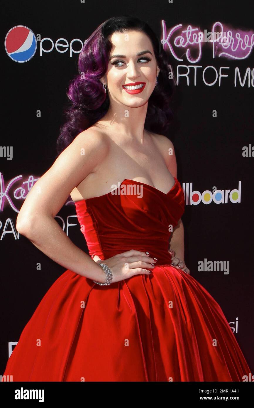Singer Katy Perry wears a lovely red strapless dress with red high ...