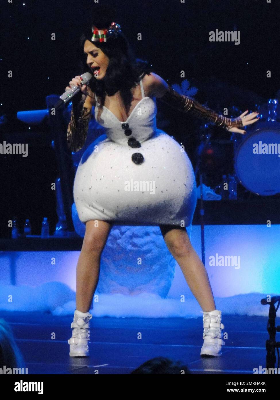 Pop singer Katy Perry emerges from a giant Christmas present and ...