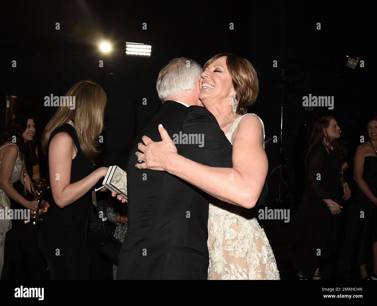 John Lithgow, left, and Allison Janney greet backstage at the 69th ...