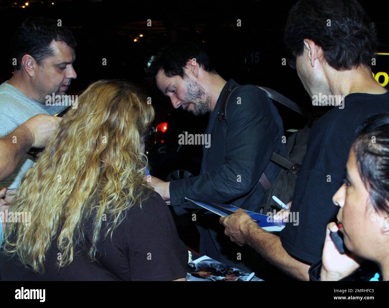 EXCLUSIVE!! Actor Keanu Reeves signs autographs as he arrives at Los ...