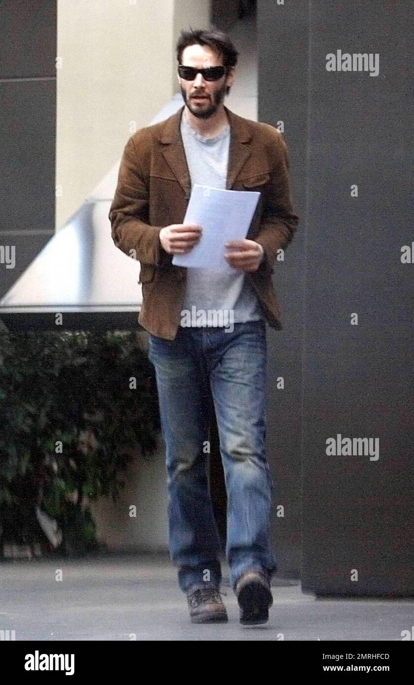 EXCLUSIVE!! Keanu Reeves is met by a driver as he leaves on a trip. The ...