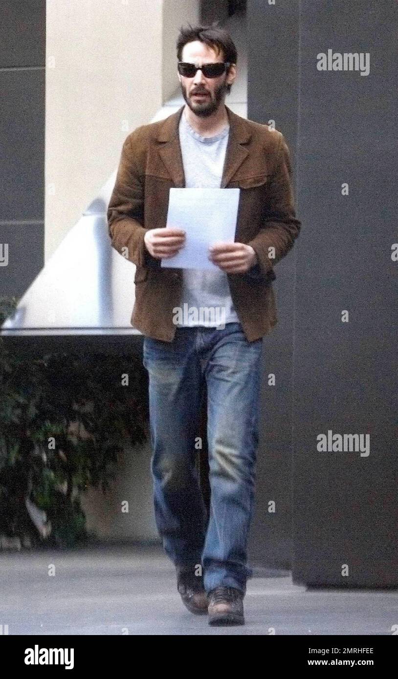 EXCLUSIVE!! Keanu Reeves is met by a driver as he leaves on a trip. The ...