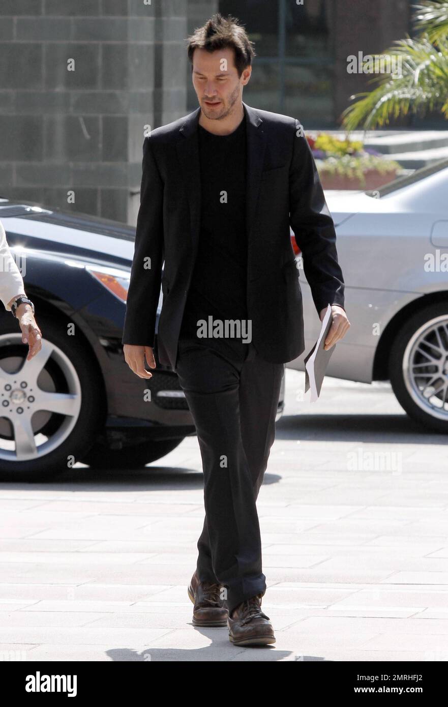 EXCLUSIVE!! Actor Keanu Reeves wears all black paired with some clunky ...