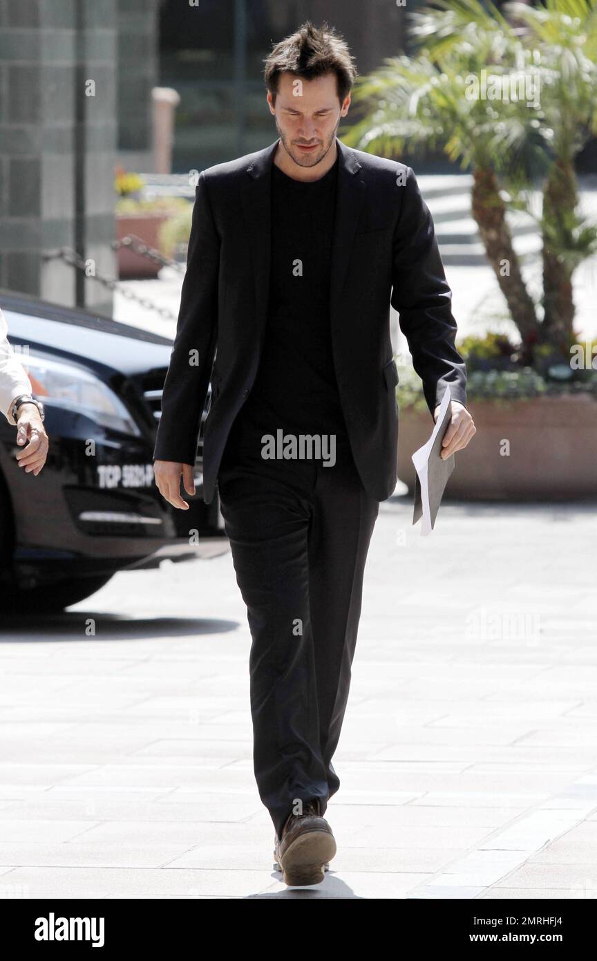 EXCLUSIVE!! Actor Keanu Reeves wears all black paired with some clunky ...