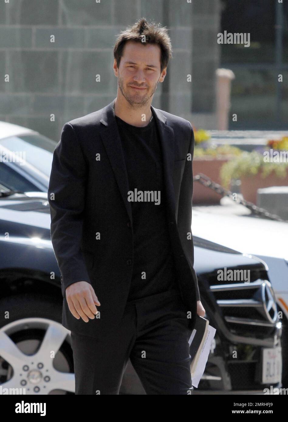 EXCLUSIVE!! Actor Keanu Reeves wears all black paired with some clunky brown boots as he arrives ...