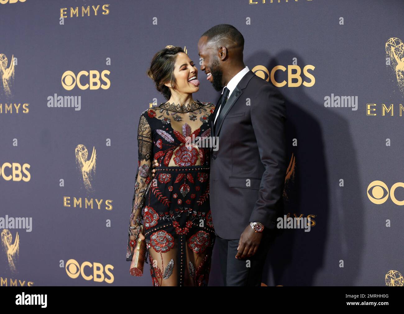 Erin Lim, left, and Lamorne Morris arrive at the 69th Primetime Emmy Awards on Sunday, Sept. 17 ...