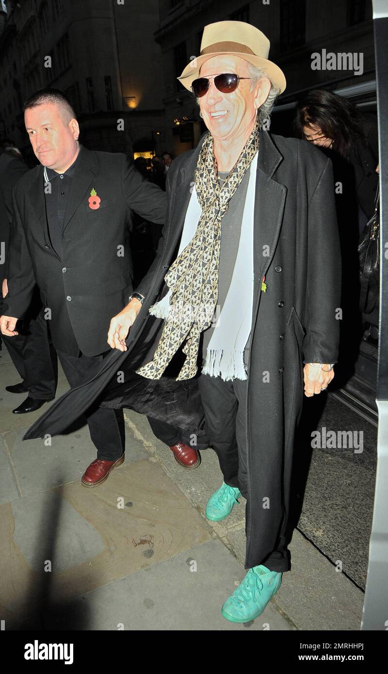 Rocker Keith Richards, wearing an outfit punctuated by bright green ...