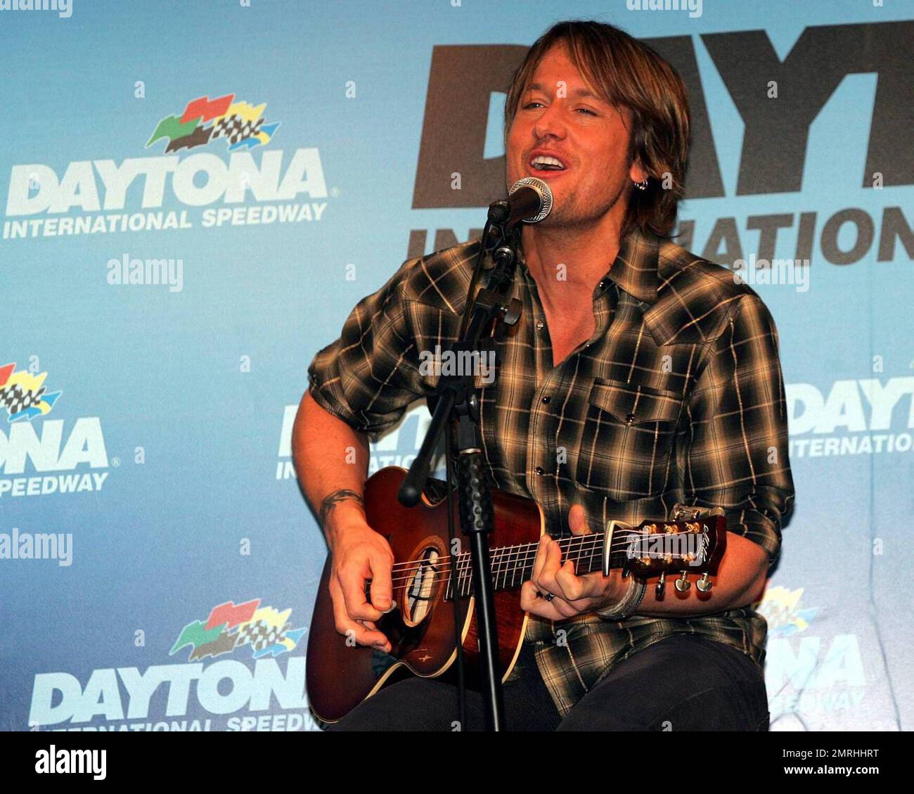 Country singer Keith Urban performs in the media center at Daytona ...