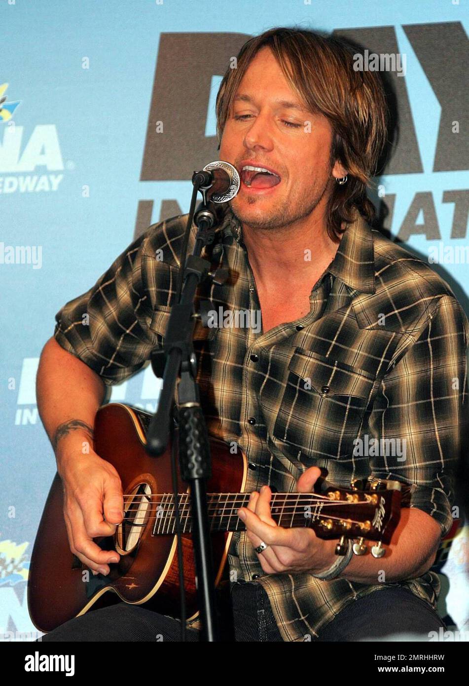 Country singer Keith Urban performs in the media center at Daytona ...