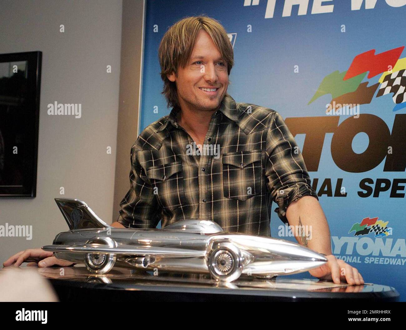 Country singer Keith Urban performs in the media center at Daytona ...