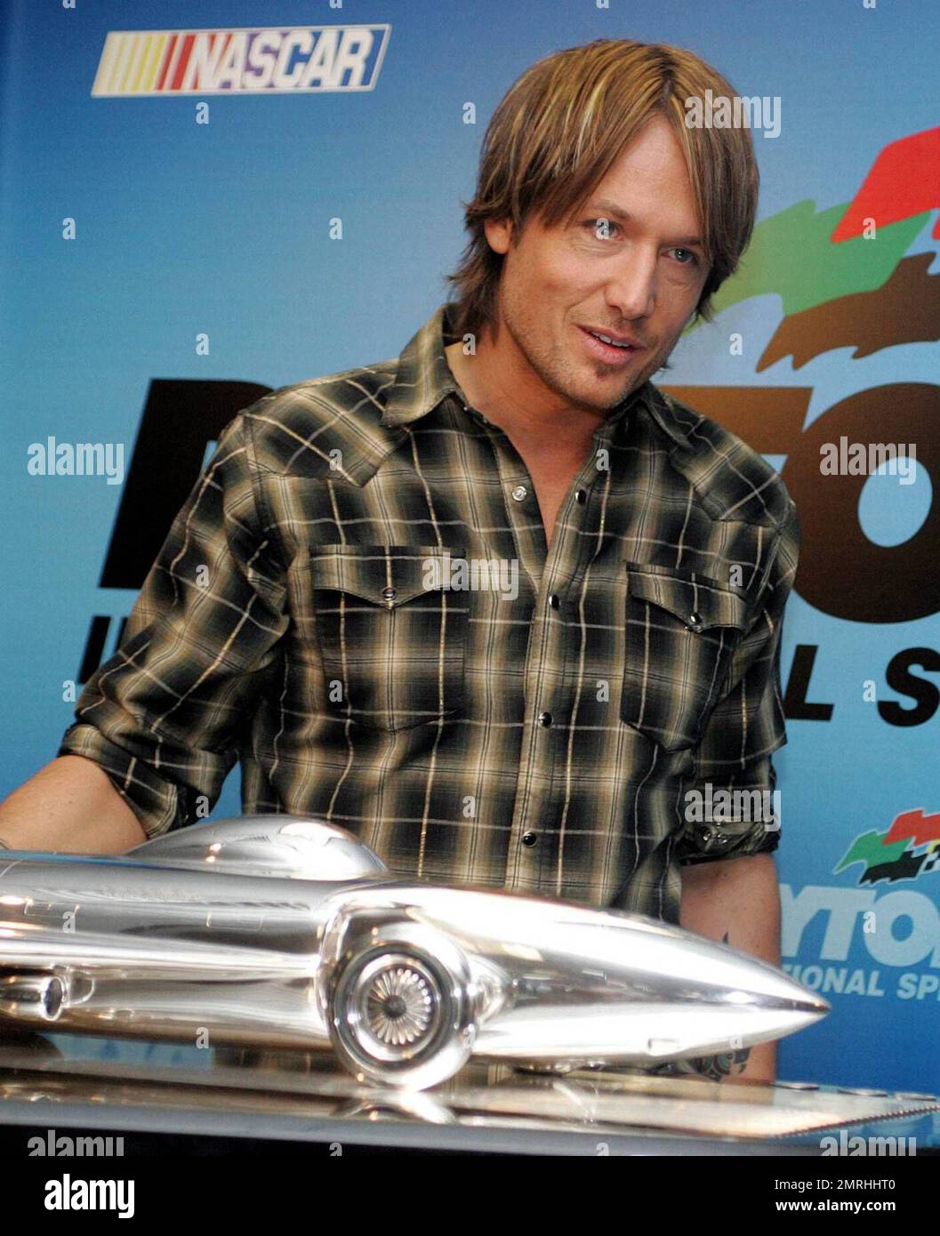 Country singer Keith Urban performs in the media center at Daytona ...