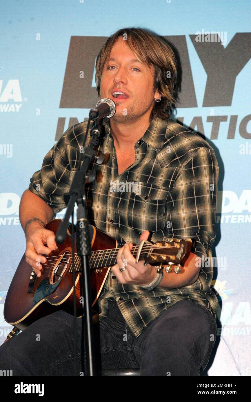 Country singer Keith Urban performs in the media center at Daytona ...