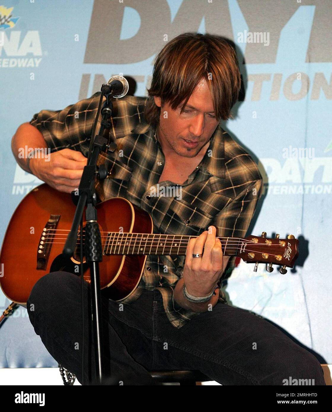 Country singer Keith Urban performs in the media center at Daytona ...