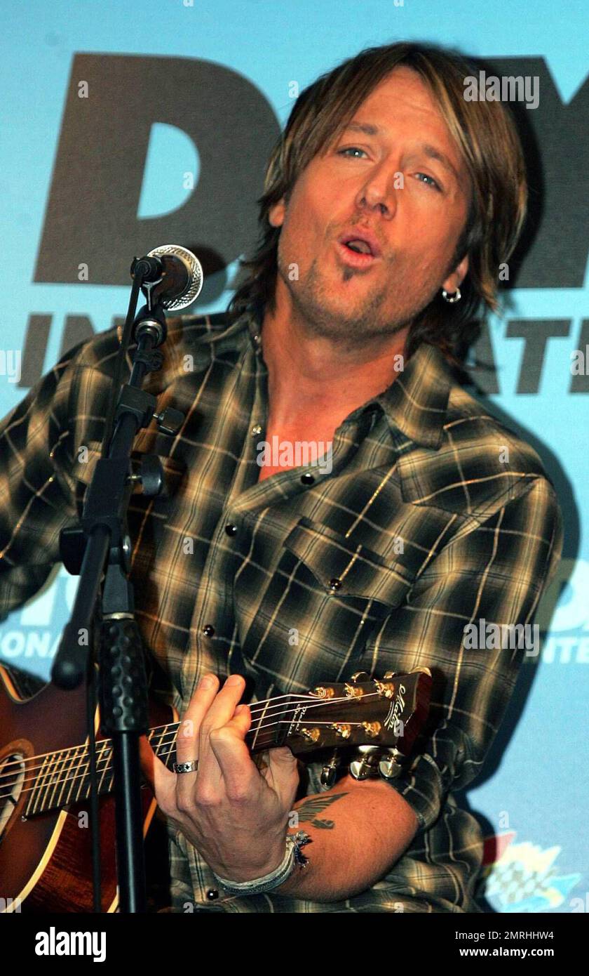 Country singer Keith Urban performs in the media center at Daytona ...