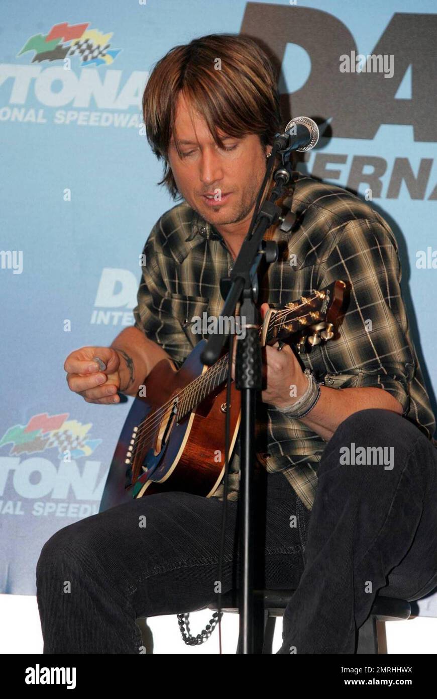 Country singer Keith Urban performs in the media center at Daytona ...