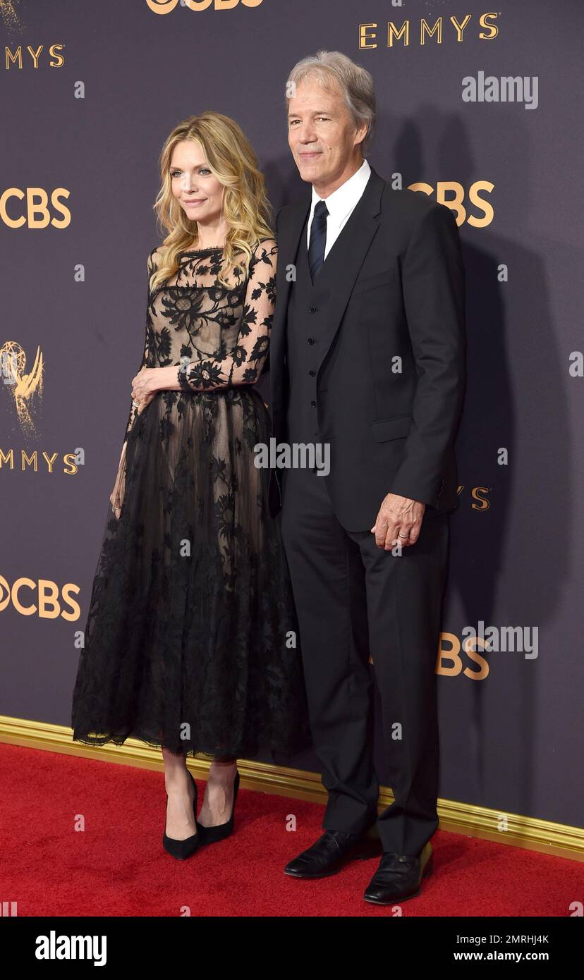 Michelle Pfeiffer, left, and David E. Kelley arrive at the 69th ...