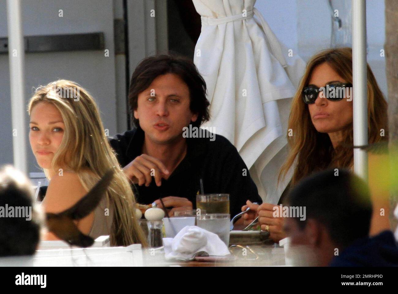 Kelly Bensimon and publicist Jonathan Cheban enjoy a bite to eat at the ...