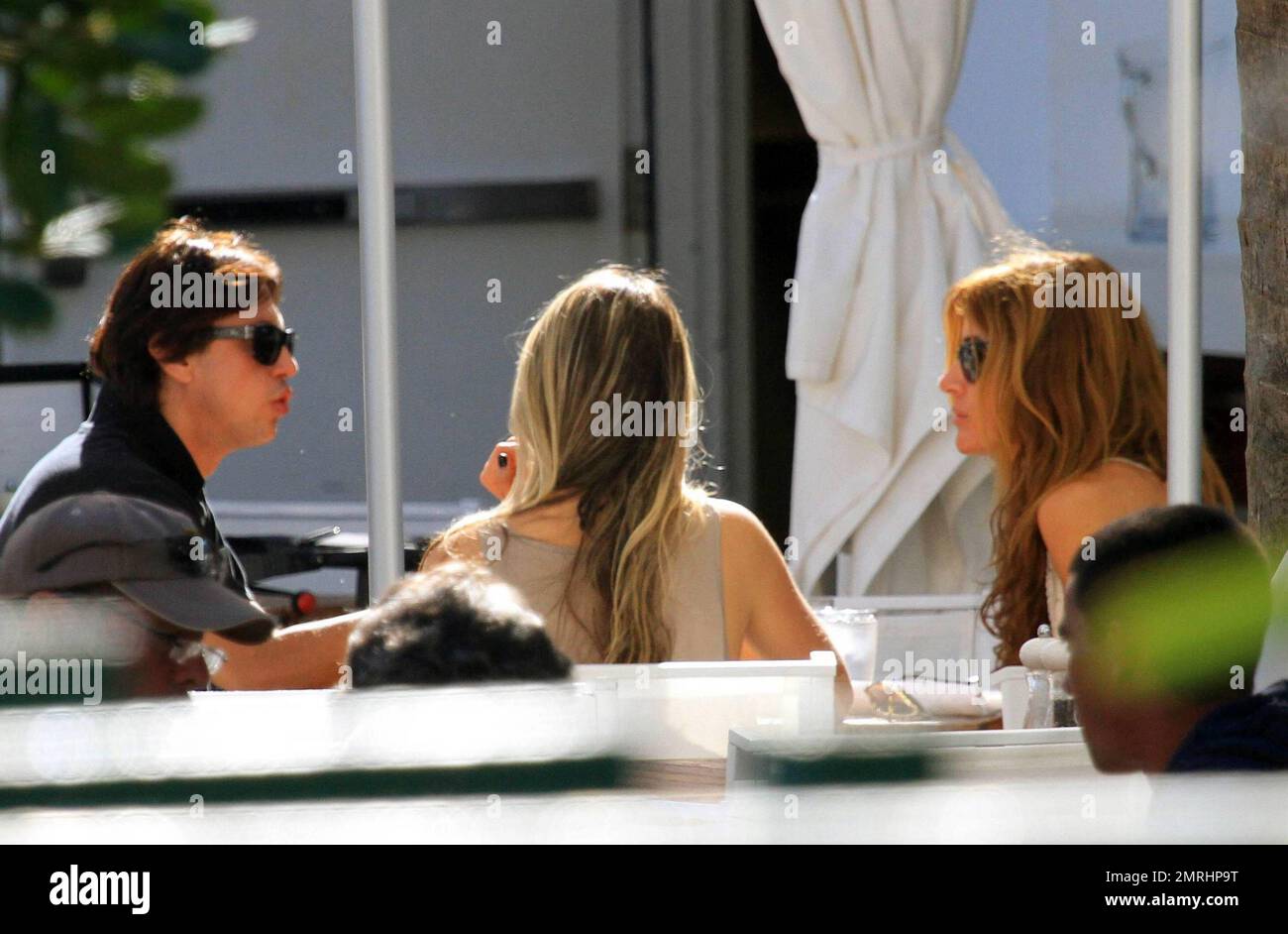 Kelly Bensimon and publicist Jonathan Cheban enjoy a bite to eat at the ...