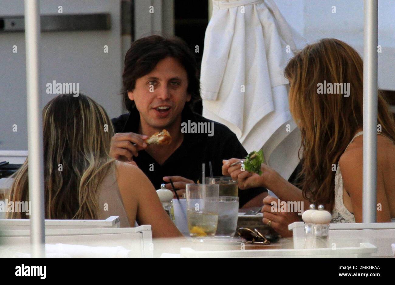 Kelly Bensimon and publicist Jonathan Cheban enjoy a bite to eat at the ...