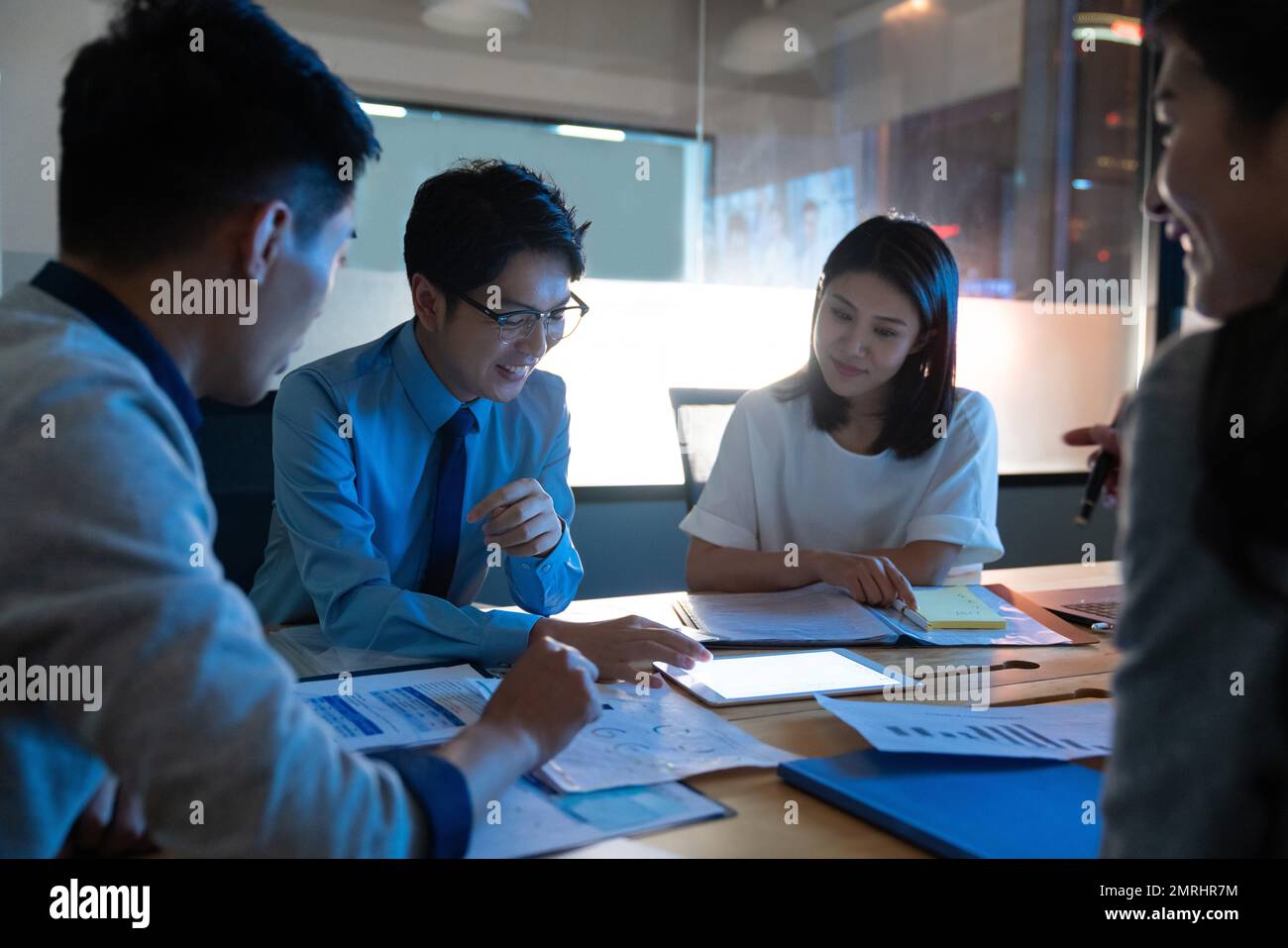 Young business people in work overtime Stock Photo - Alamy