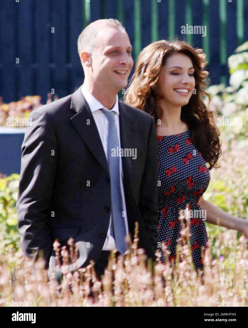 Model and actress Kelly Brook, clad in a cute summer bow-detailed mini ...