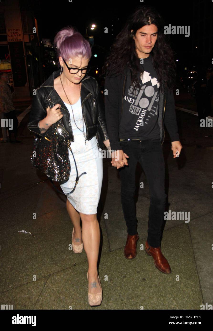 Kelly Osbourne holds hands with boyfriend Matthew Mosshart as the pair ...