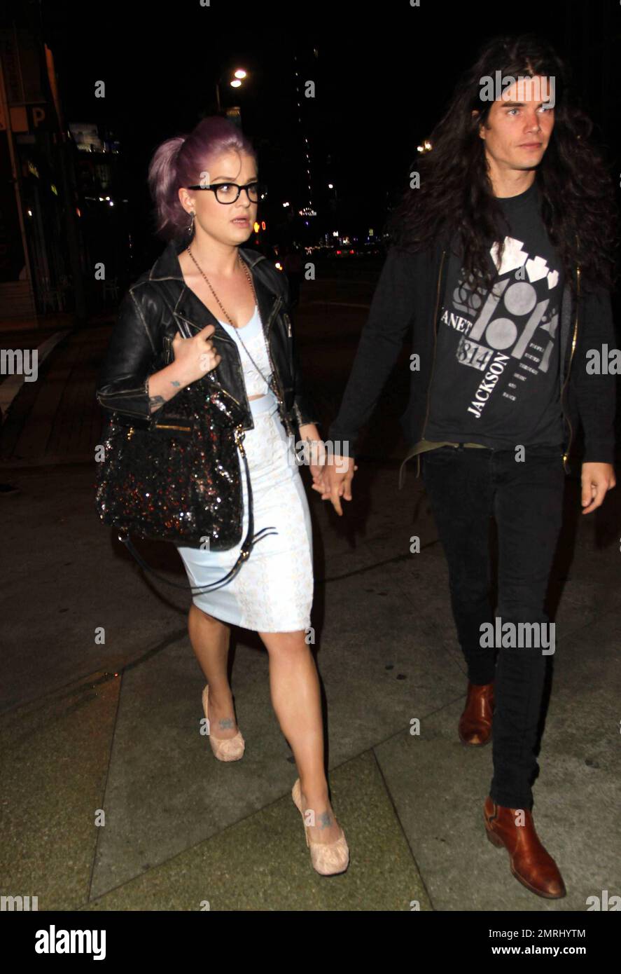 Kelly Osbourne holds hands with boyfriend Matthew Mosshart as the pair ...