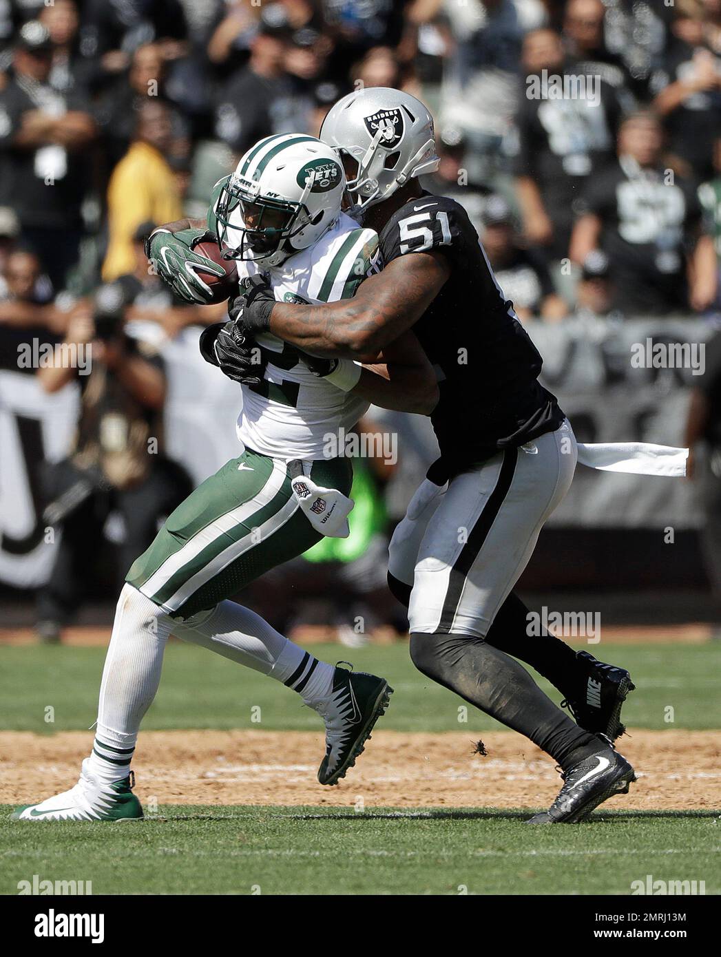 Oakland Raiders outside linebacker Bruce Irvin (51) tackles New York ...