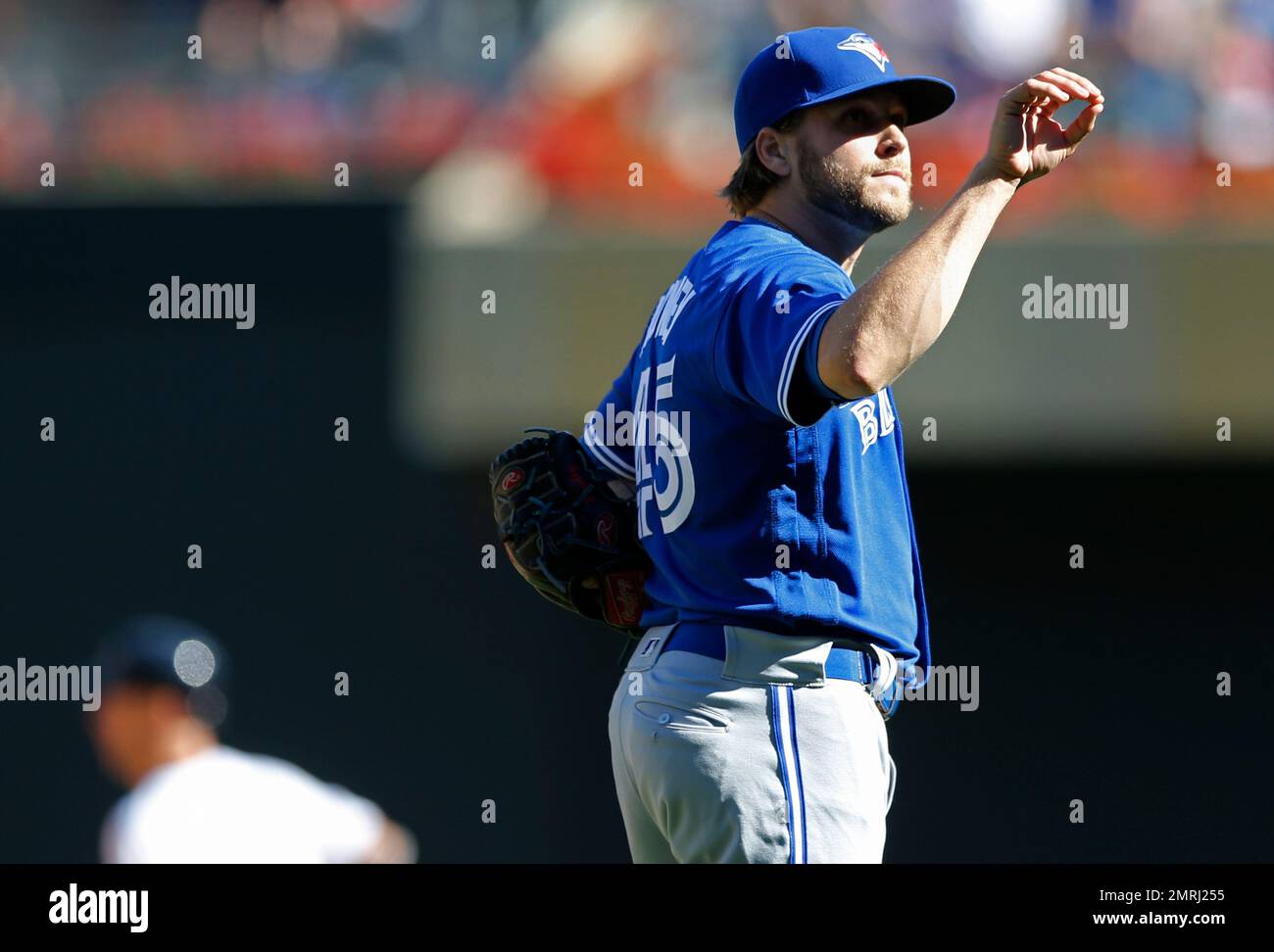 Toronto Blue Jays relief pitcher Chris Rowley, right, reacts as Minnesota Twins' Joe Mauer ...