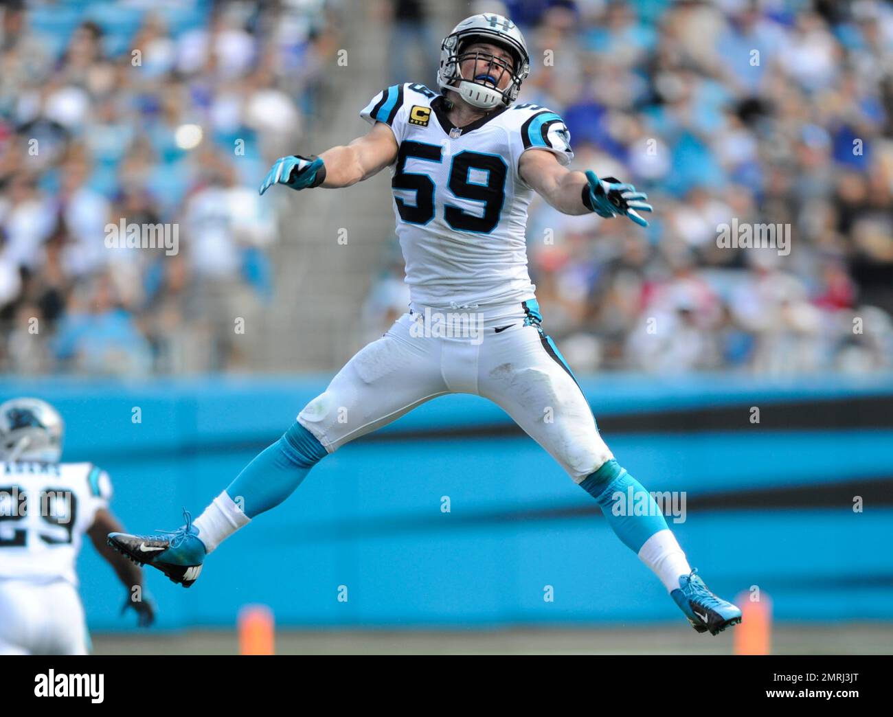 Carolina Panthers' Luke Kuechly (59) leaps high to try and stop a pass ...