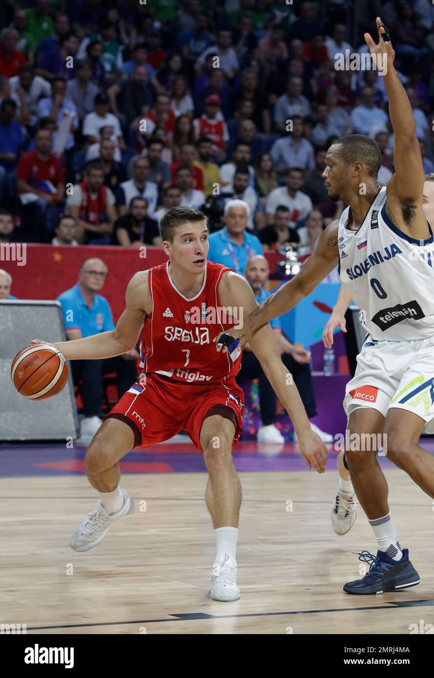 Serbia's Bogdan Bogdanovic, left, drives to the basket as Slovenia's ...